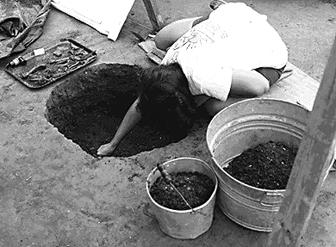 An ancient storage pit being excavated by archaeologists | NCpedia