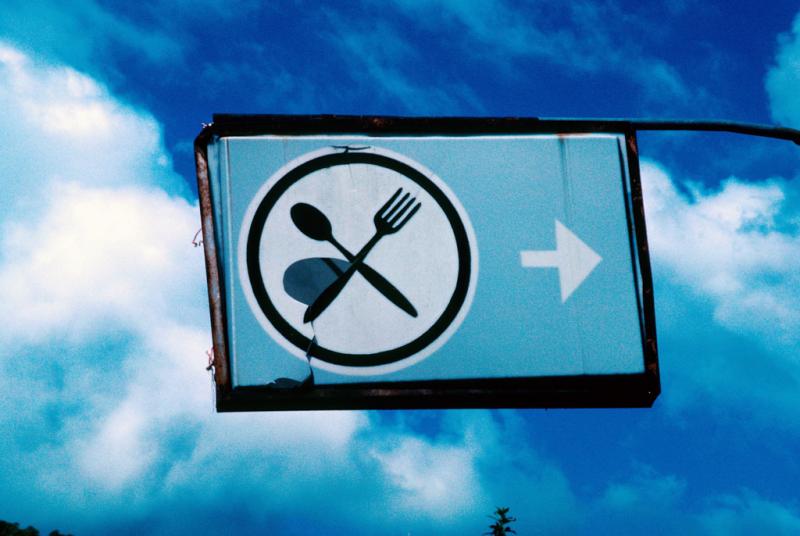 Restaurant sign showing crossed fork and spoon | NCpedia