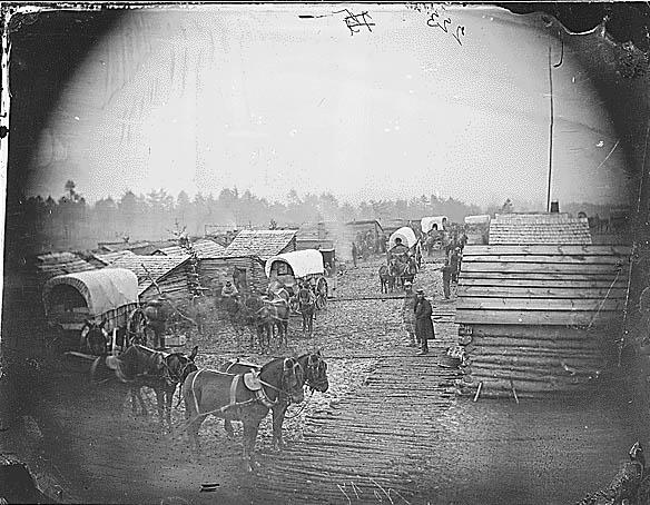 Civil War camp scene showing winter huts and corduroy roads | NCpedia
